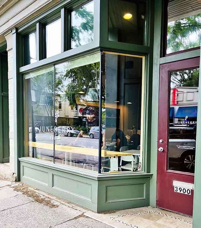 That sage green storefront with the burgundy door isn't just charming, it's your gateway to breakfast bliss.