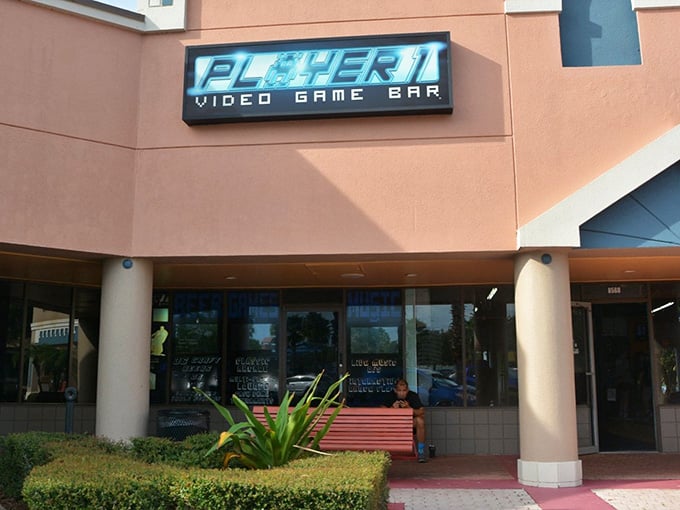 That glowing sign beckons like a lighthouse for anyone who ever spent their allowance on Pac-Man.