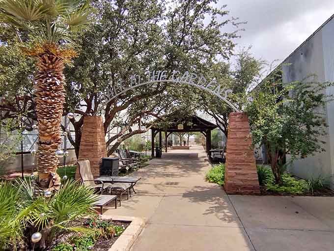 That entrance arch beckons like a portal to another world, promising shade, serenity, and seriously good eats ahead.