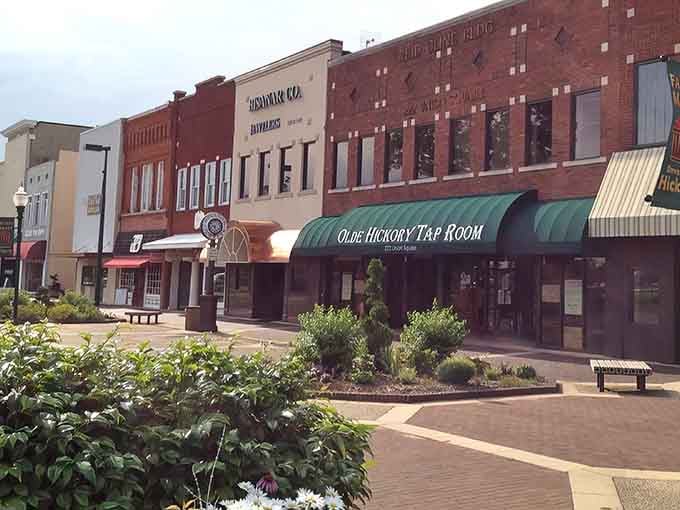 The Olde Hickory Tap Room anchors a streetscape that remembers when quality mattered more than quarterly earnings reports.
