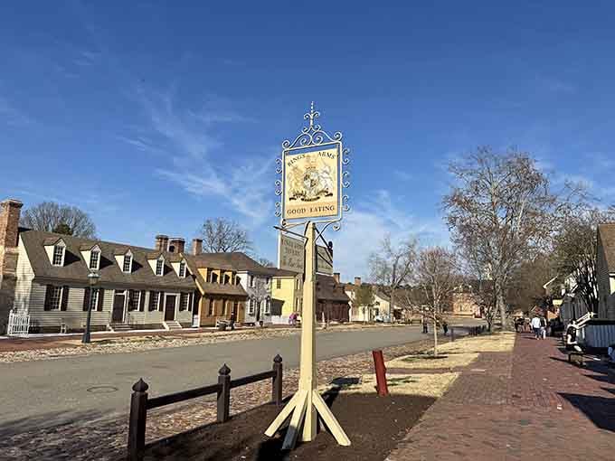 That ornate tavern sign promises "Good Eating" in a town where history and hospitality have shared the table for centuries.