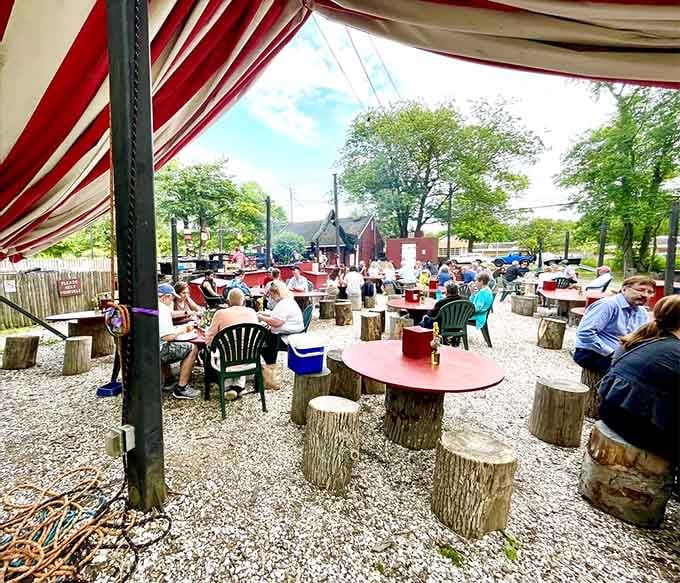 Under striped awnings with tree-stump seating, strangers become friends over butter-drenched seafood: community dining at its messy, glorious best.