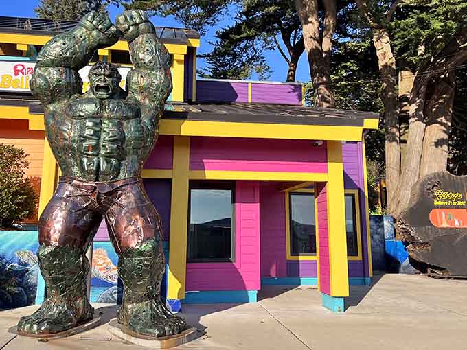A muscular creature guards the entrance like the world's most intimidating doorman, setting the tone for the wonderfully bizarre adventure awaiting inside.