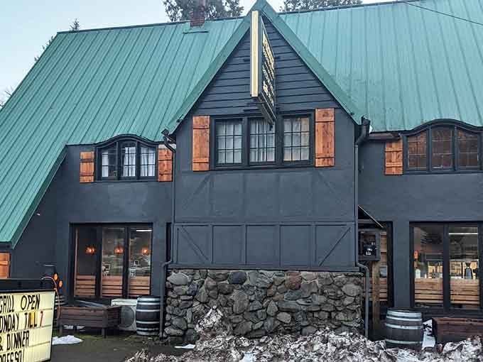 That green metal roof and stone foundation aren't just for show; they're your beacon to burger paradise in the woods.