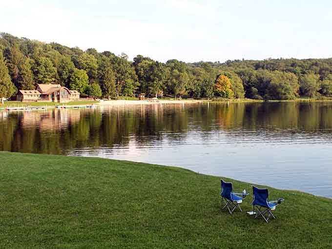 Two chairs by the lake, waiting for you to finally remember what relaxation feels like.