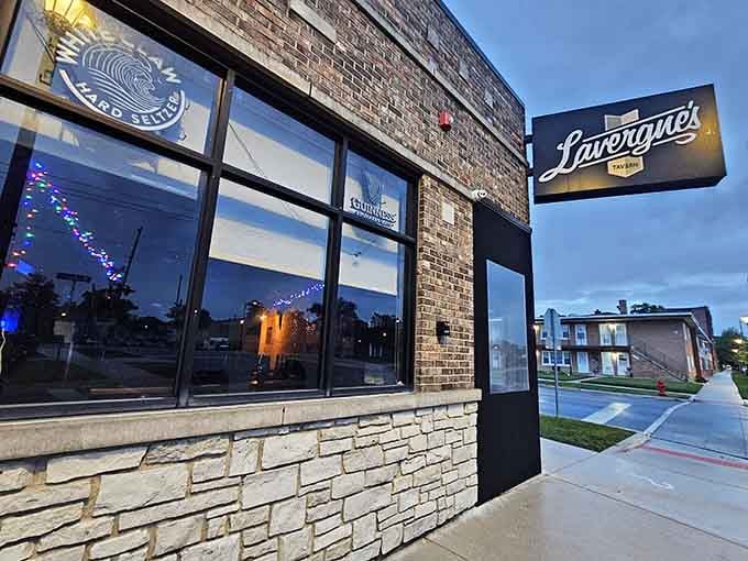 That corner storefront glow means someone inside is doing bar food the right way, trust us on this.