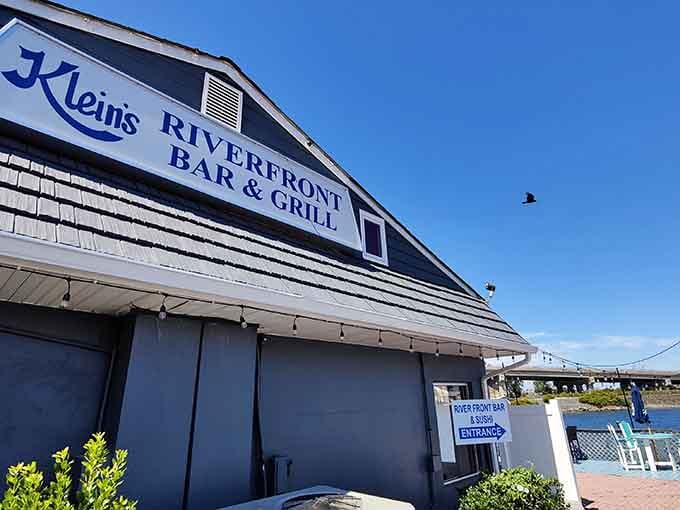 That iconic Klein's logo against blue sky signals you've arrived at seafood paradise, no passport required for this journey.