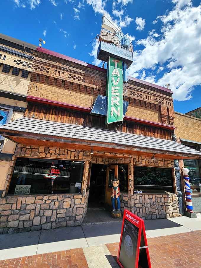That vintage "TAVERN" sign glowing against bright skies proves some Colorado treasures hide in plain sight downtown.
