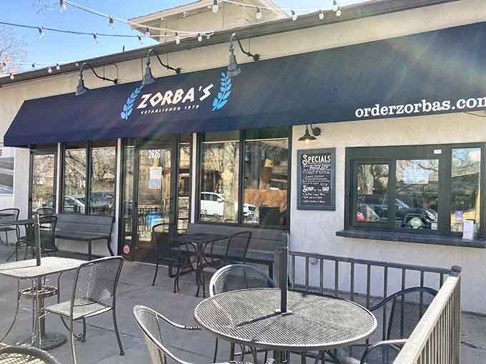 That blue awning beckons like a lighthouse guiding hungry sailors to breakfast paradise on a Denver morning.