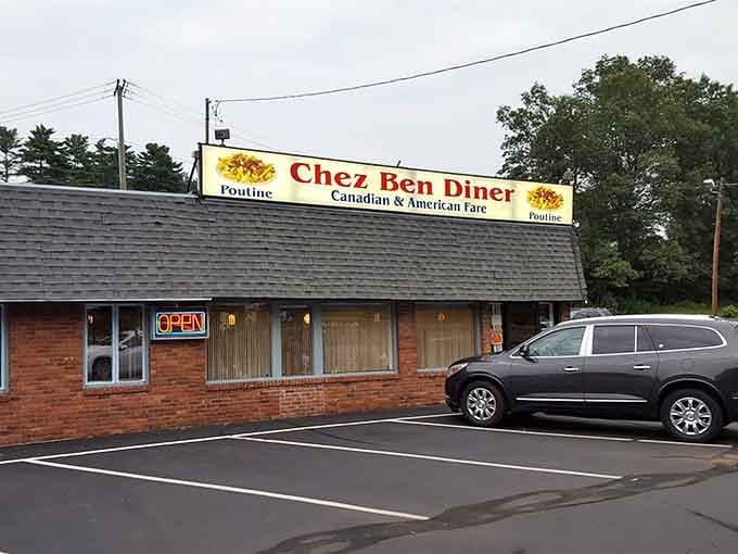 That brick exterior and bold poutine promise tell you everything: this is where comfort food meets Canadian charm.