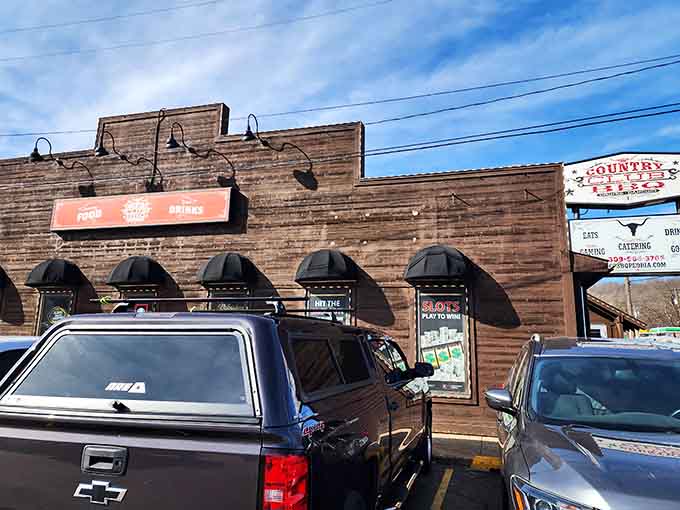 That wood-paneled exterior isn't trying to impress anyone, which is exactly why it impresses everyone who knows good barbecue.