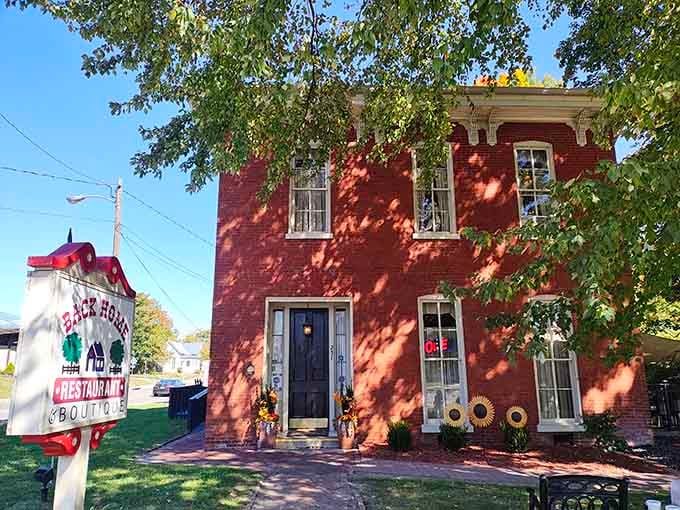 That red brick facade practically glows with Southern hospitality, promising comfort food treasures hidden inside those historic walls.
