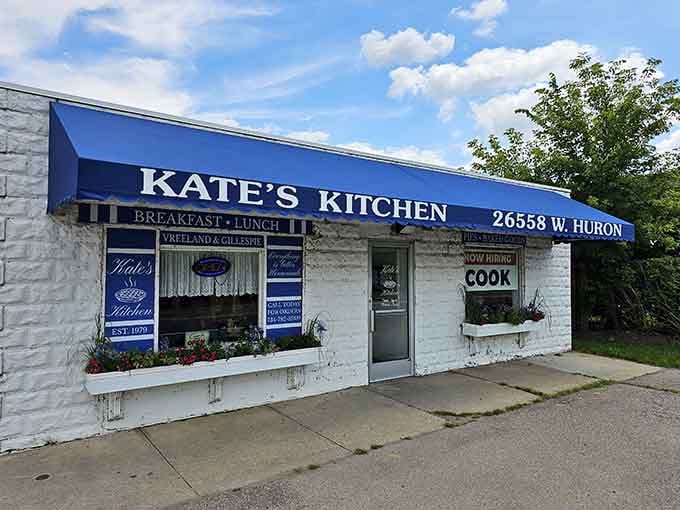 That cheerful blue awning on West Huron River Drive is your beacon to breakfast paradise in Flat Rock.