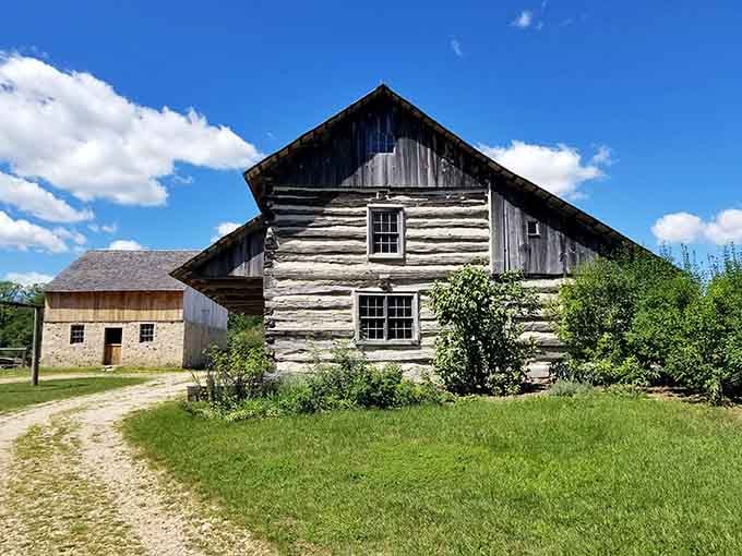 Hand-hewn logs and weathered wood tell stories your smartphone never could, where history stands solid under blue skies.