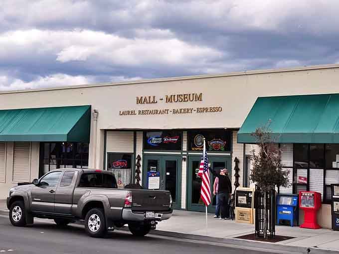 That green awning marks the entrance to breakfast next to a full-sized locomotive, naturally.