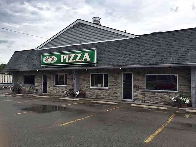 That green and white sign isn't just marking a building, it's pointing you toward pizza salvation in Louisville.