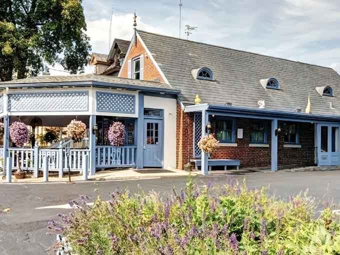 That charming brick facade and welcoming porch are your first hint that something special awaits inside.