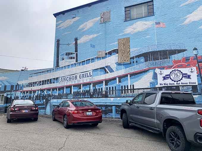 That riverboat mural isn't just pretty, it's your first clue that breakfast magic awaits inside this Covington gem.