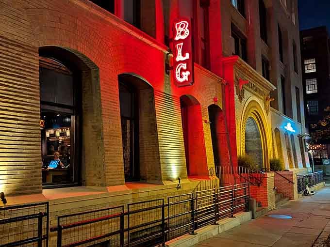 That glowing red signage against historic brick isn't just a restaurant, it's a beacon calling pasta lovers home.
