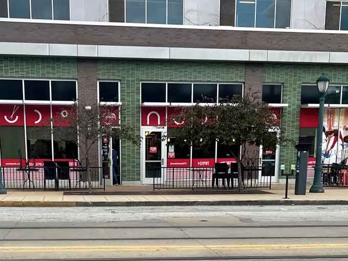 That bold red storefront isn't shy about announcing what's waiting inside for your taste buds.