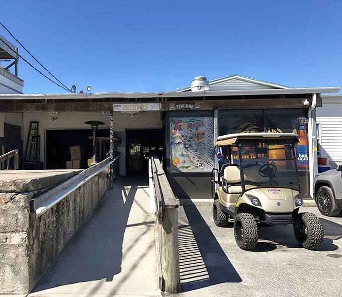 That vintage Florida map and tiki bar sign aren't just decoration, they're a promise of authentic waterfront paradise ahead.