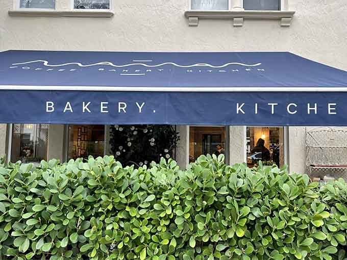 That blue awning isn't just pretty, it's your beacon to buttery croissants and cookies that'll ruin all other cookies forever.