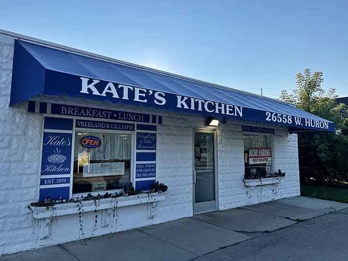 That cheerful blue awning on West Huron River Drive is your beacon to breakfast paradise in Flat Rock.