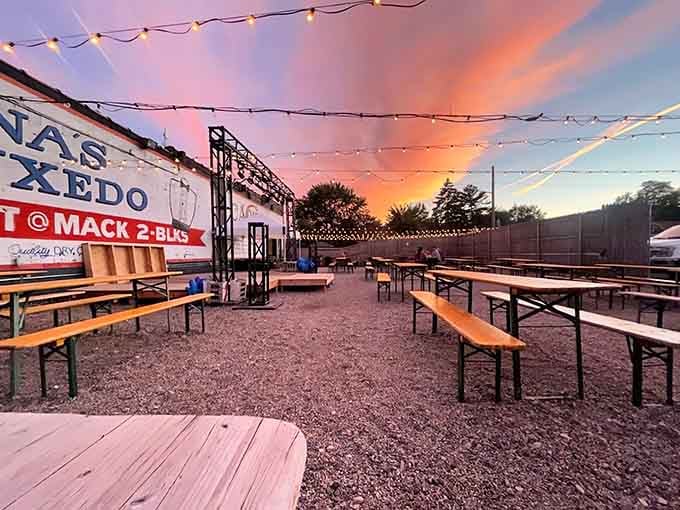Sunset paints the sky as the beer garden beckons, promising cold brews and warm conversations under twinkling lights.