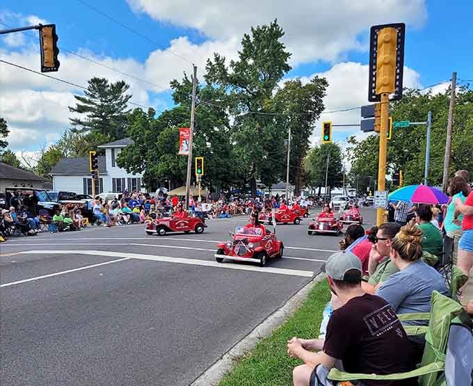 Those vintage red cars rolling through downtown prove this parade takes its apple theme seriously and spectacularly.