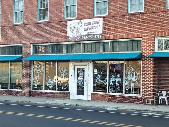 That turquoise awning and those whimsical window characters are your first clue that breakfast just got interesting.