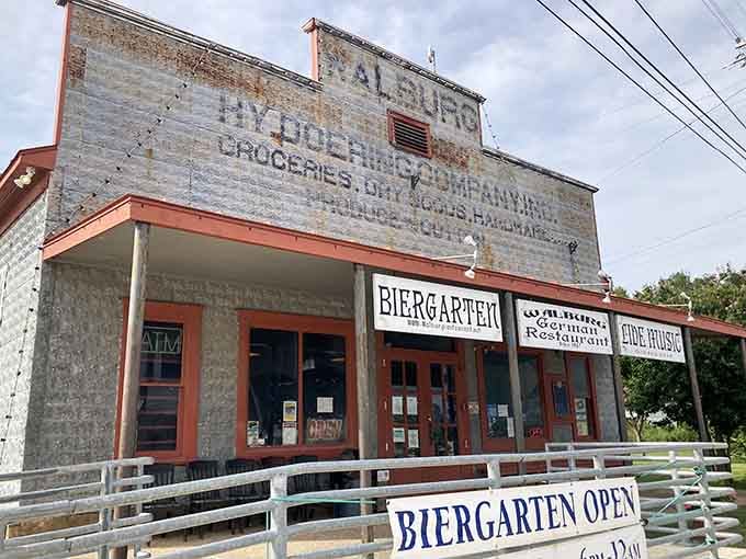 That faded ghost sign advertising groceries and dry goods tells you this building has stories to share.