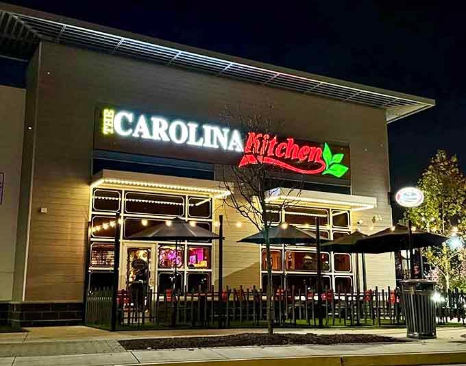 That glowing sign isn't just lighting up the night, it's broadcasting a promise of Southern comfort that draws crowds like moths to a delicious flame.