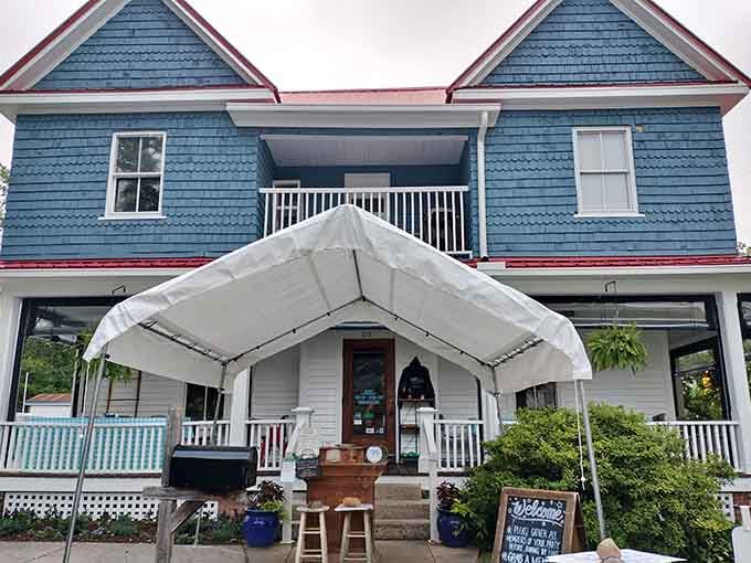 That blue house with the red roof isn't just charming, it's where breakfast dreams come true every single day.