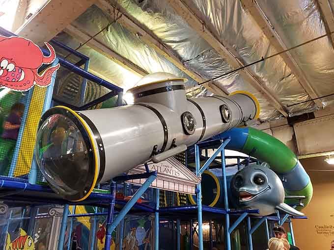 This massive submarine structure dominates the space like a friendly sea creature, complete with portholes and tubes that promise adventure at every turn.
