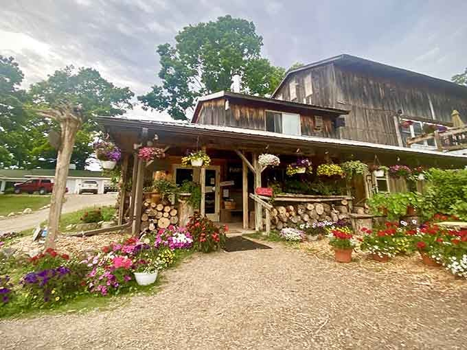 This rustic barn wrapped in flowers looks like it wandered off a Hallmark movie set and decided to start making wine.