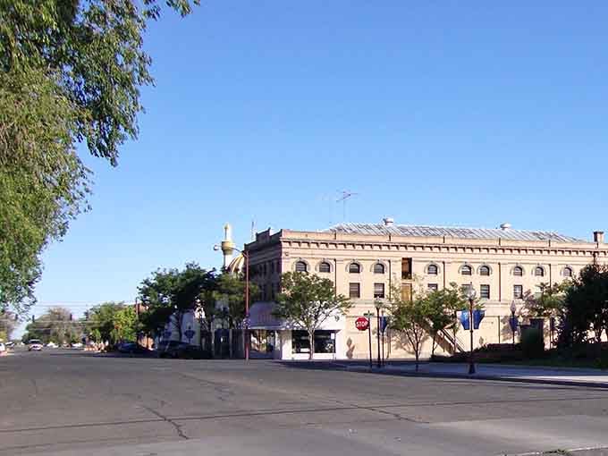 Experience the charm of downtown Montrose, where historic brick architecture and vintage signs invite you to explore this welcoming community.