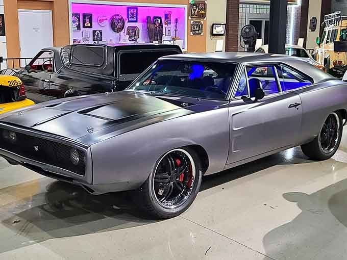 A sleek charger that's seen more action than most stunt doubles, looking sharp under museum lights.