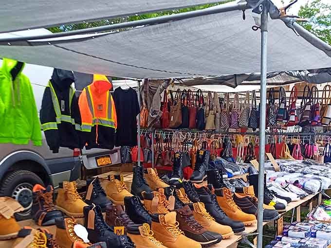 Work boots and handbags share space under canvas tents where practical meets stylish in perfect harmony.