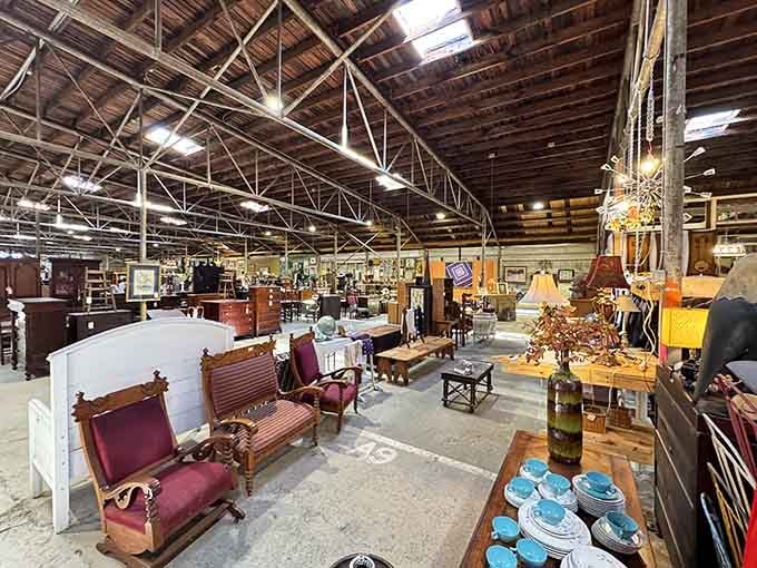 Step inside this cathedral of curiosities where exposed beams tower overhead and treasures stretch beyond the horizon.