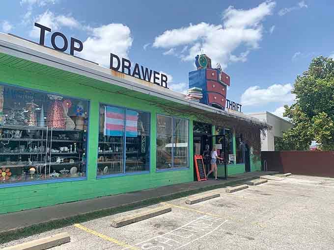 That cheerful green exterior and whimsical rooftop dresser sculpture promise vintage adventures await inside this Austin treasure trove.