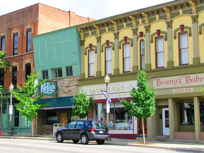 Classic storefronts line downtown Saline, where yellow buildings and red awnings create a Main Street America postcard come to life.