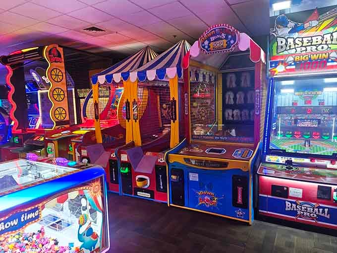 Bright neon lights and colorful arcade games fill this exciting indoor playground, featuring everything from classic carnival booths to sports challenges.