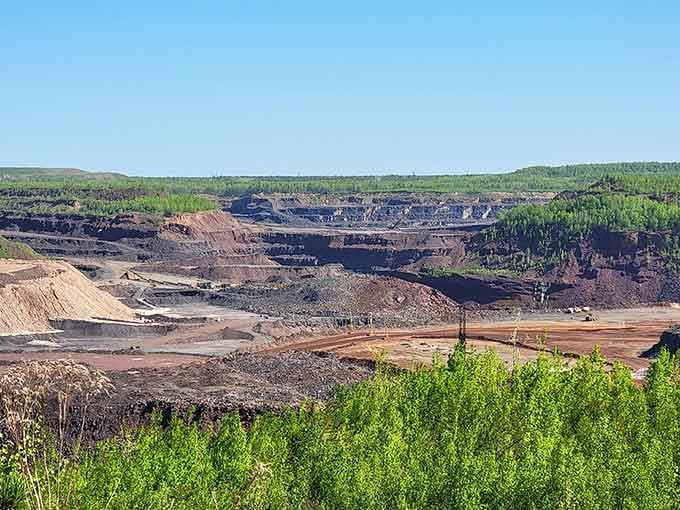 The active mining operation in full swing, where massive machinery moves mountains while you watch from a comfortable viewing distance.
