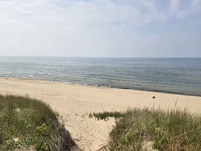 The path through the dunes opens up to reveal your own private slice of lakefront heaven.