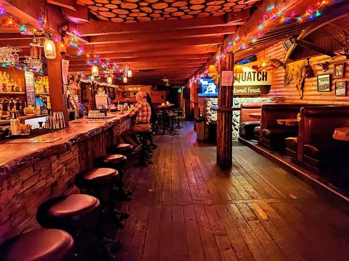 This warm red bar beckons like a lighthouse for the thirsty, promising woodland adventures and excellent cocktails ahead.