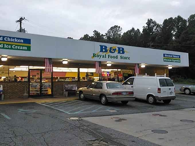 The unassuming exterior of B & B Royal Food Store, where culinary dreams come true next to the gas pumps.