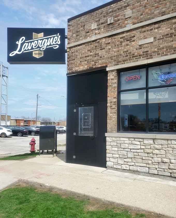 That corner storefront glow means someone inside is doing bar food the right way, trust us on this.
