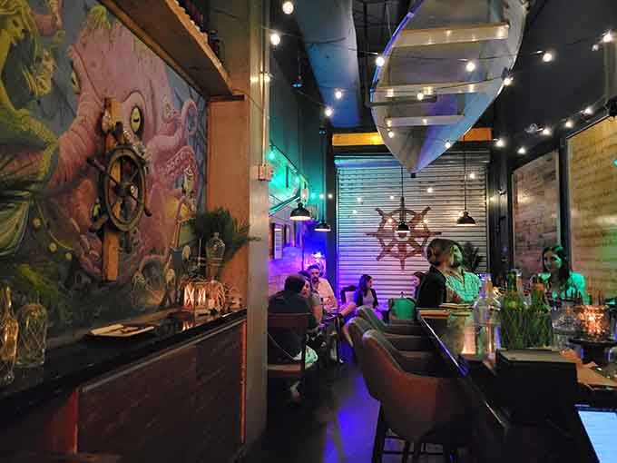 Vintage maritime murals and moody lighting transform a simple evening out into a voyage worth remembering and repeating.