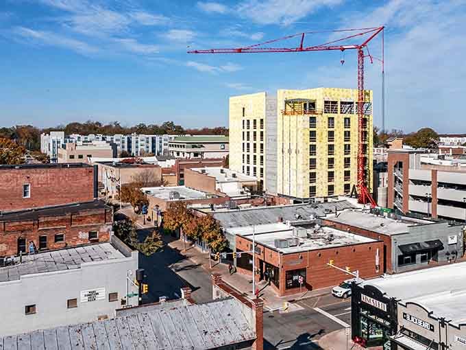 New construction meets historic brick buildings, proving progress doesn't require bulldozing everything that came before it.