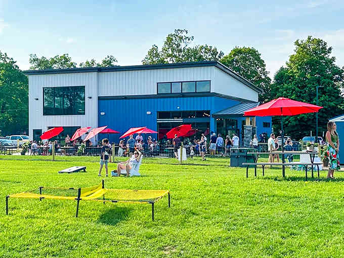 The modern barn aesthetic meets family paradise, where sprawling green space promises freedom for restless little legs.